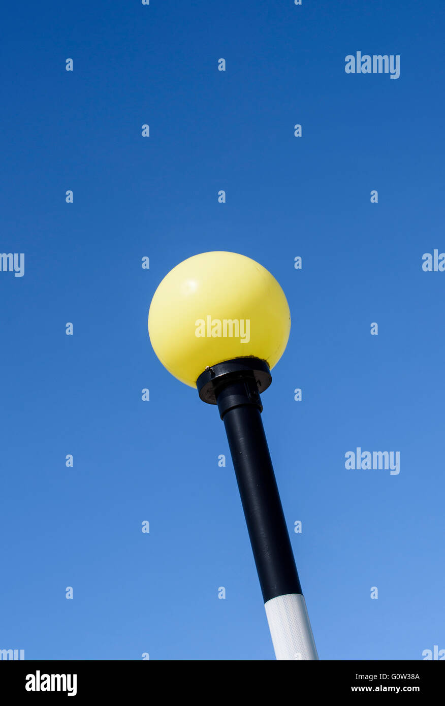 A belisha beacon marking the position of a pedestrian crossing ...