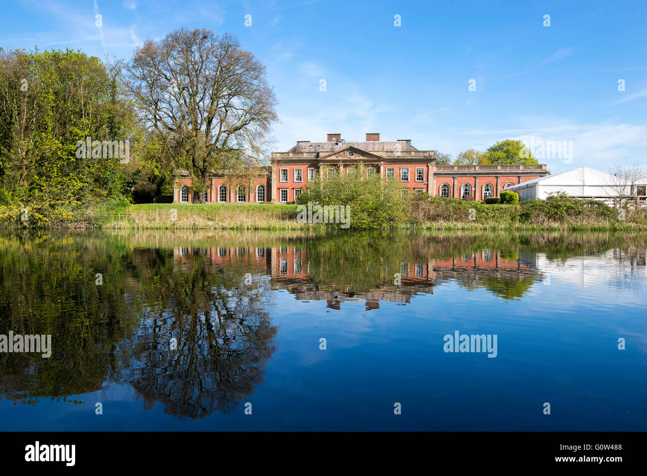 Colwick Hall Hotel, reflected in a lake at Colwick Park in Nottingham ...