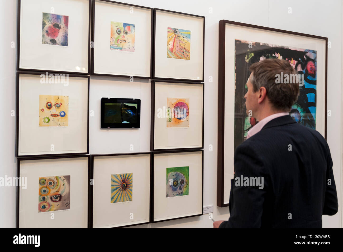 London, UK. 4 May 2016. Visitors view prints on display at the preview ...