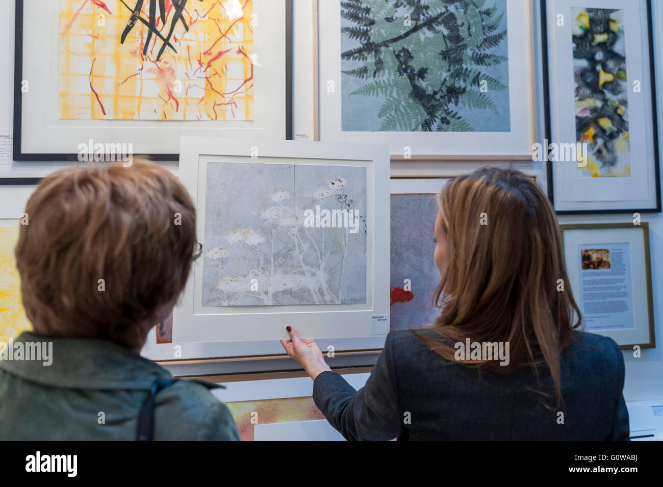 London, UK. 4 May 2016. Visitors view prints on display at the preview ...