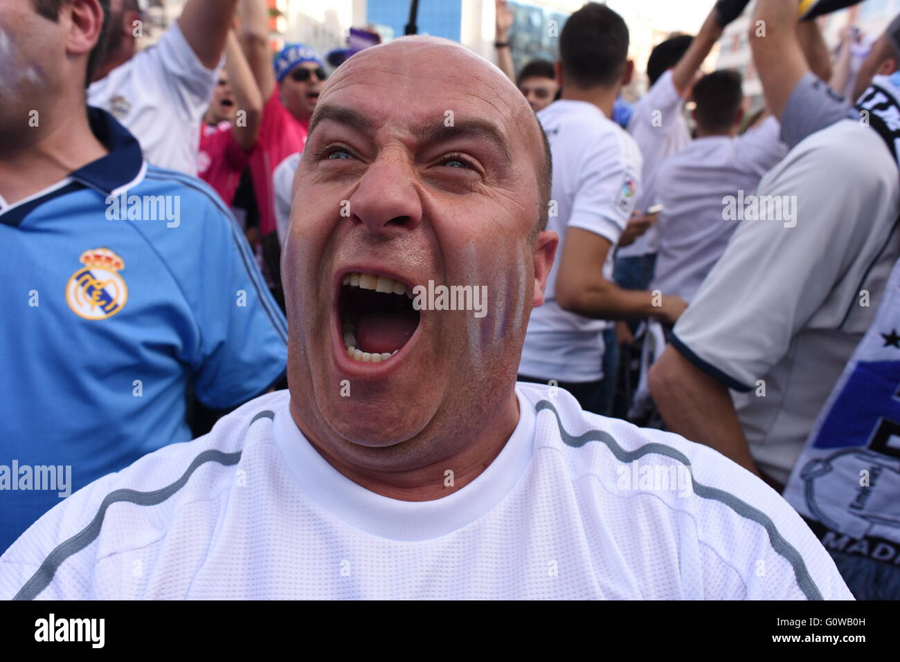 A Real Madrid fan shouts slogans as the players arrive at the Santiago ...