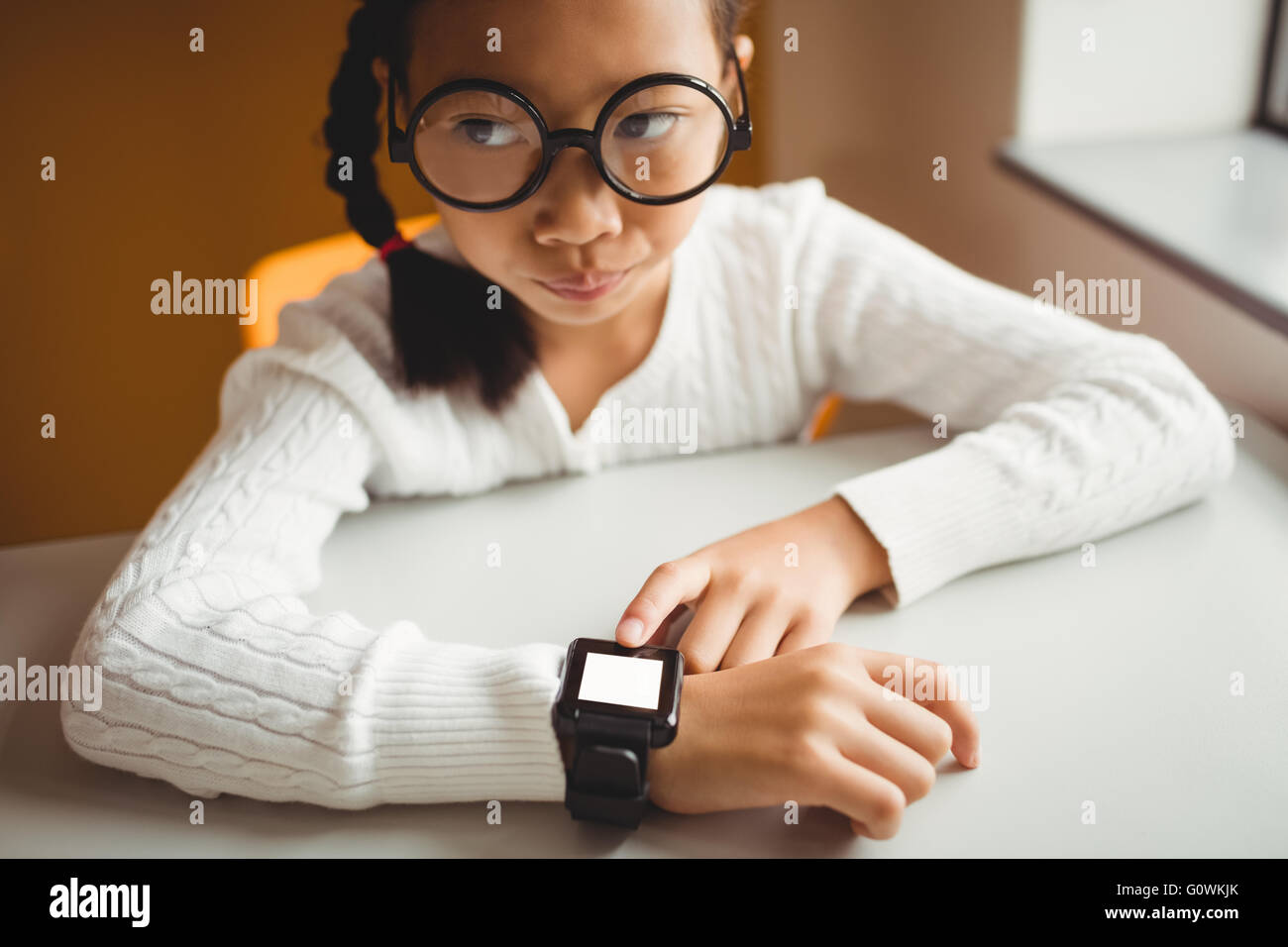 Schoolchild wearing a smart watch Stock Photo - Alamy