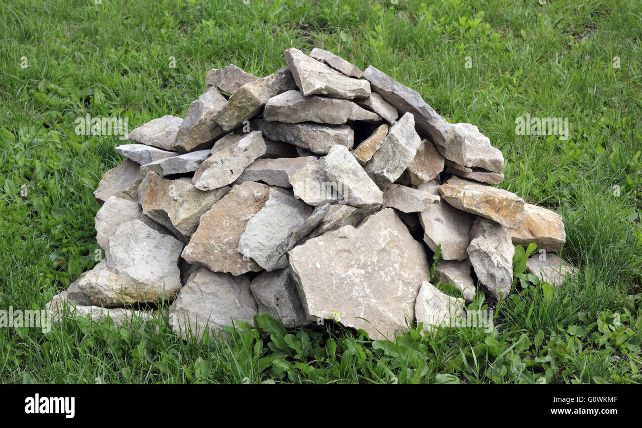 A mass of rocks on the green grass photo Stock Photo - Alamy