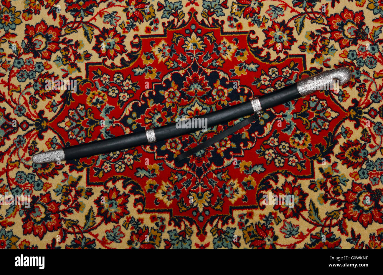 Circassian cavalry sword in a sheath on the carpet photo Stock Photo ...