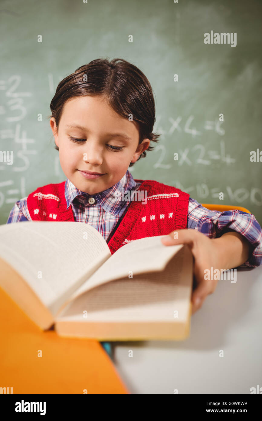 A little boy reading a book Stock Photo - Alamy