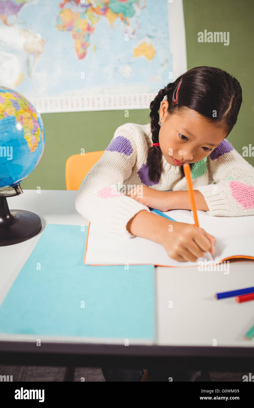 Girl writing in her notebook Stock Photo - Alamy
