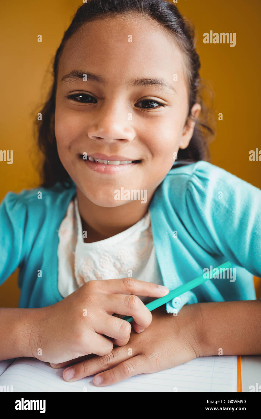 Girl sitting at a desk Stock Photo - Alamy
