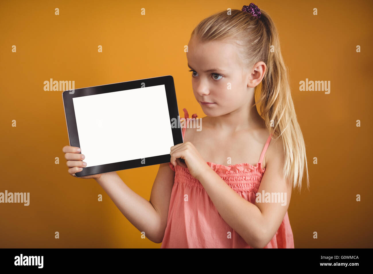 Child girl holding computer tablet hi-res stock photography and images ...