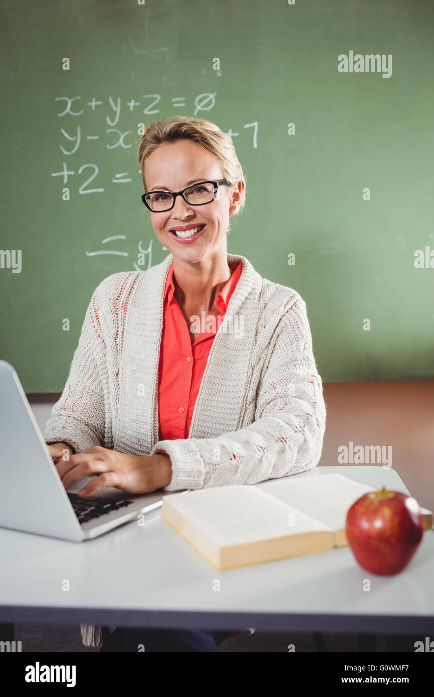 Teacher using a laptop Stock Photo - Alamy