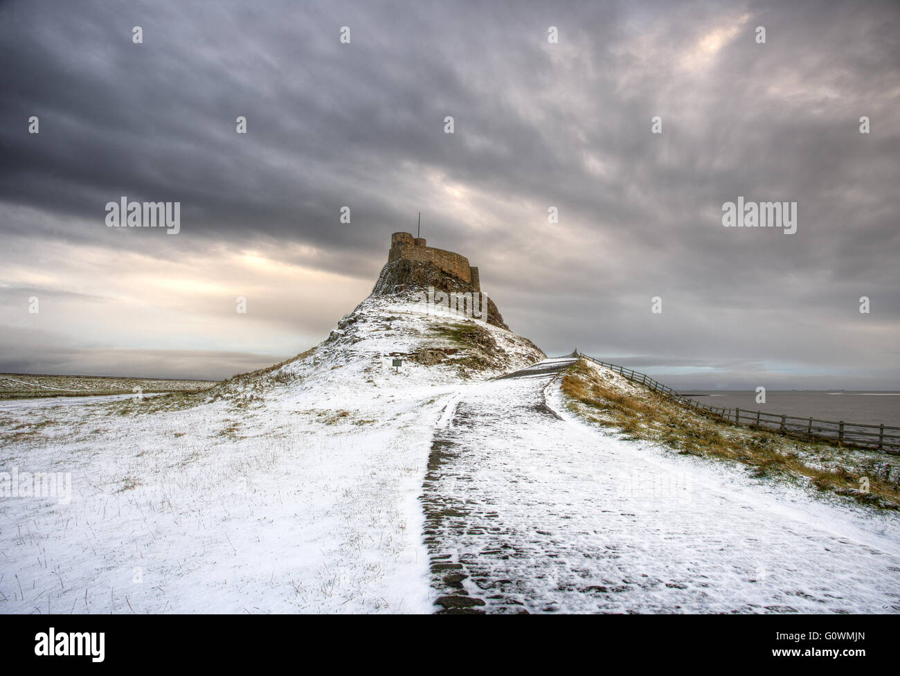 A light dusting of snow on the ground at Lindisfarne Castle with the ...