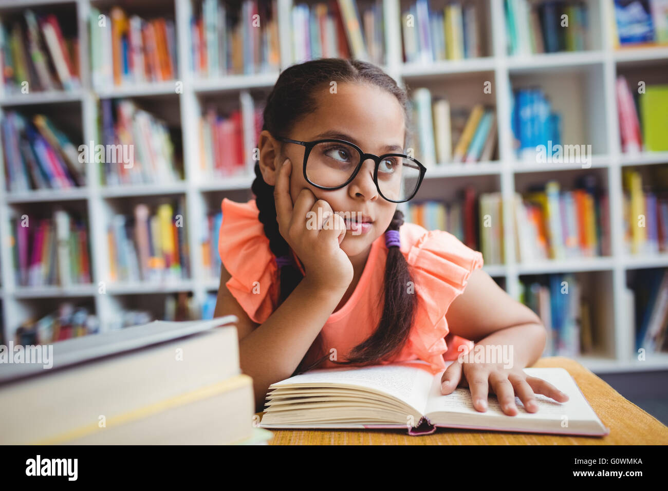 Little girl reading a book Stock Photo - Alamy