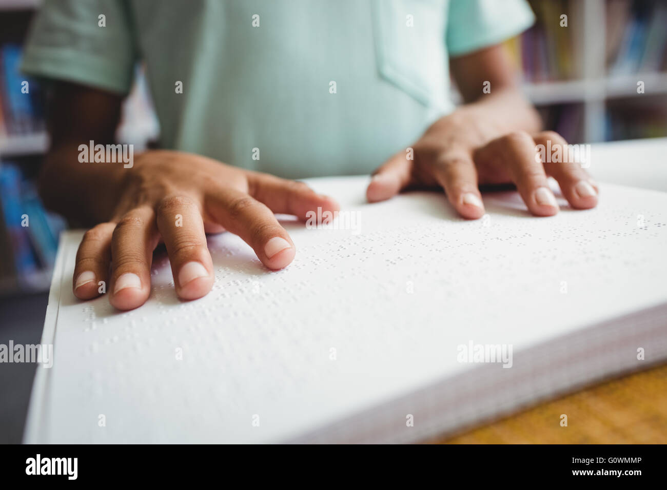 Boy using braille to read Stock Photo - Alamy
