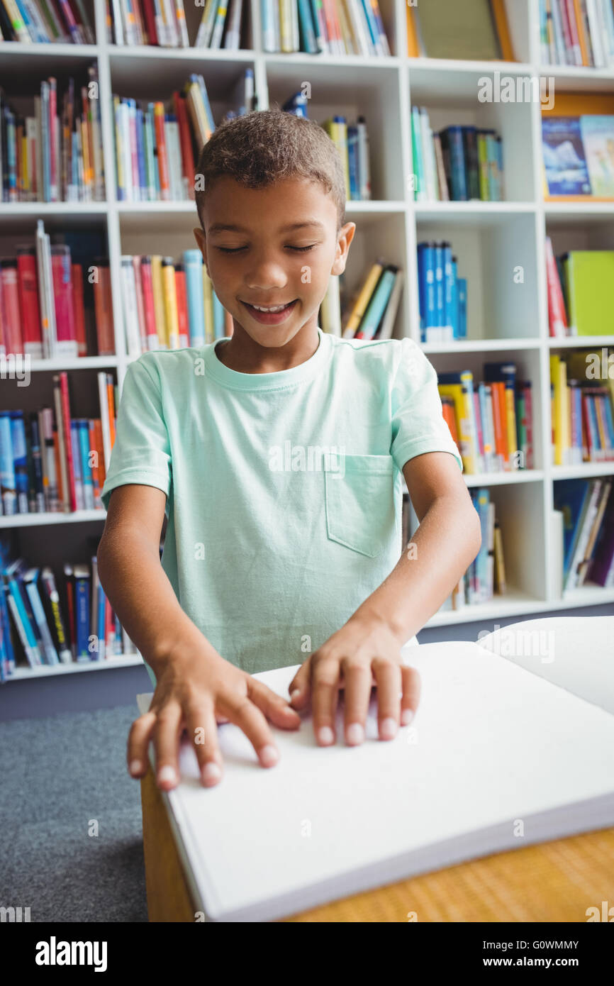 Boy using braille to read Stock Photo - Alamy