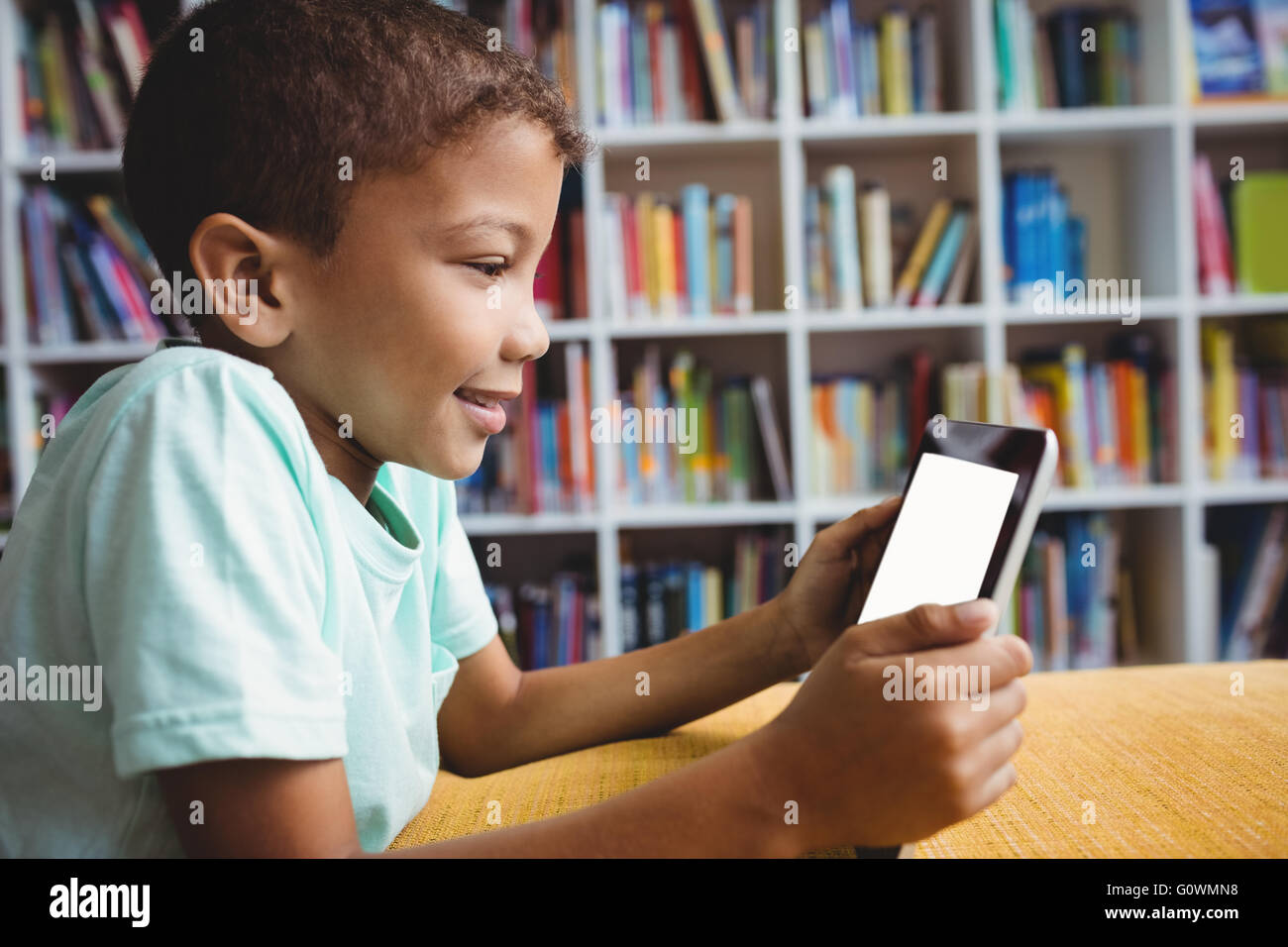 Little boy using a tablet Stock Photo - Alamy