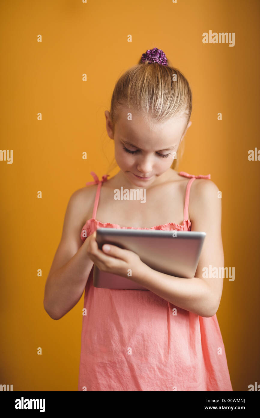 Little girl using a tablet Stock Photo - Alamy