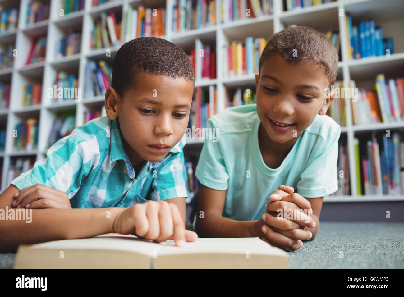 Little boys reading a book Stock Photo - Alamy