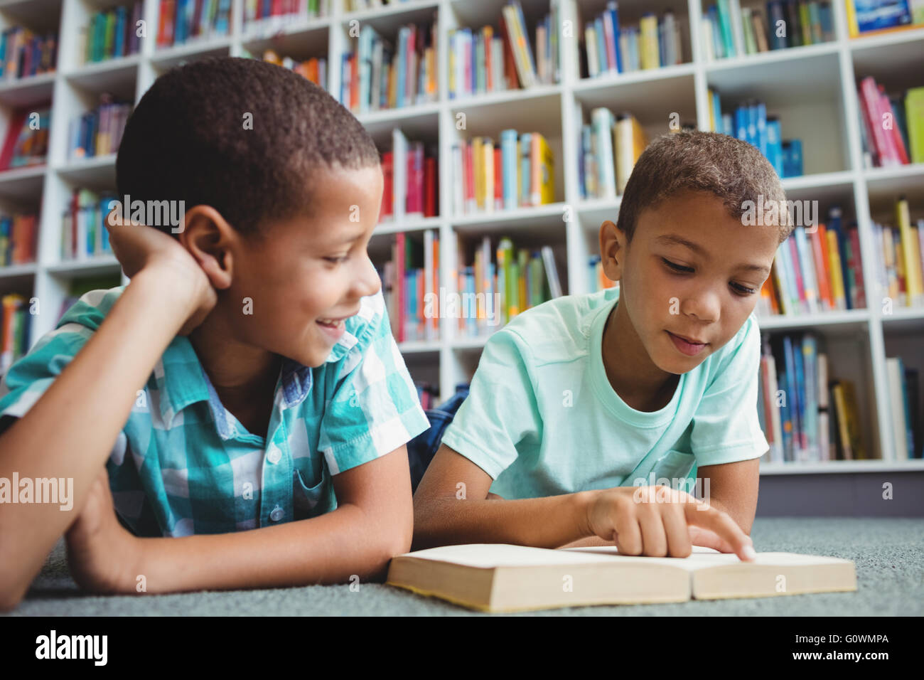 Boys reading book hi-res stock photography and images - Alamy