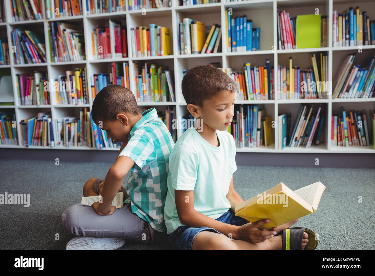 Boys reading books hi-res stock photography and images - Alamy