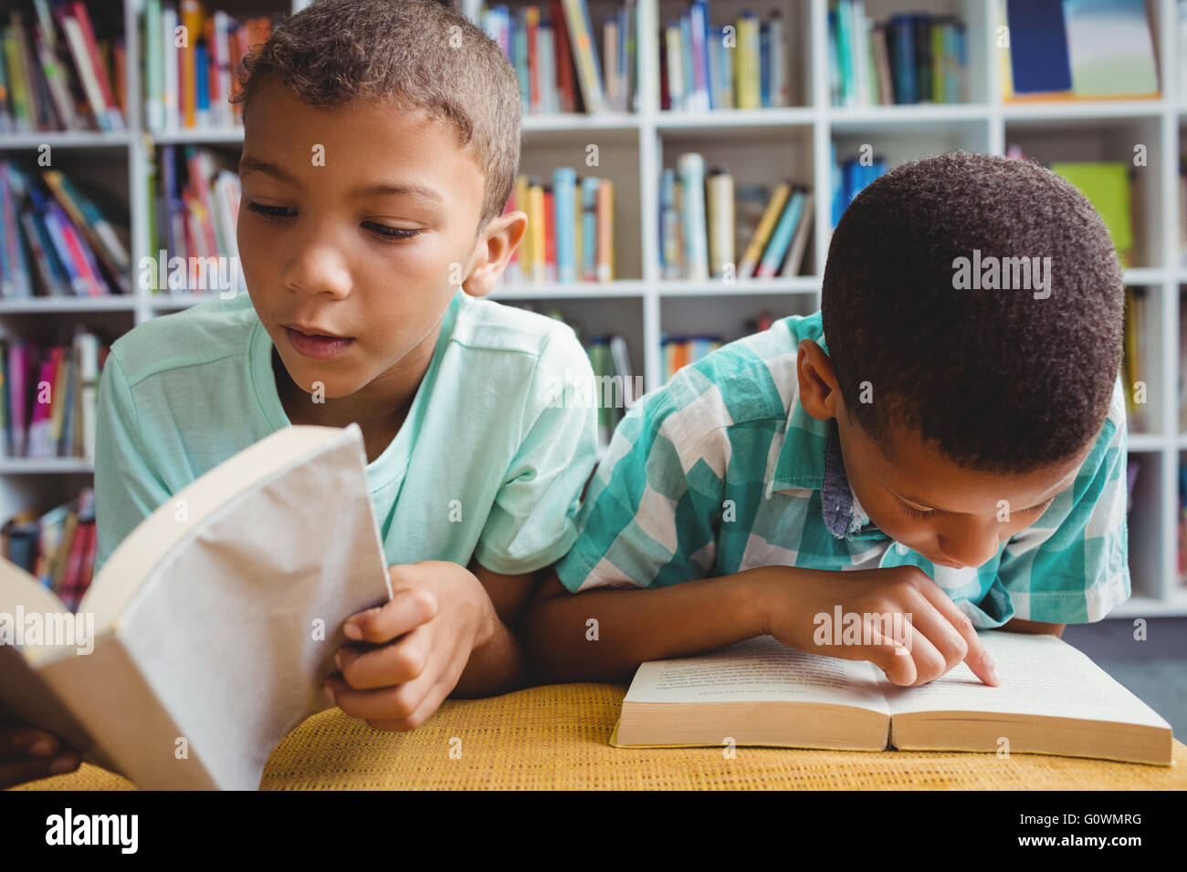 Little boys reading books Stock Photo - Alamy