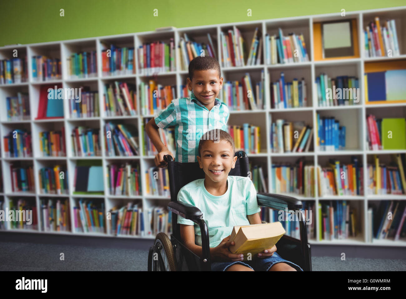 Little boys holding books Stock Photo - Alamy