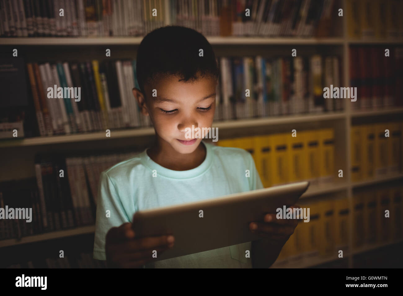 Little boy using a tablet Stock Photo - Alamy
