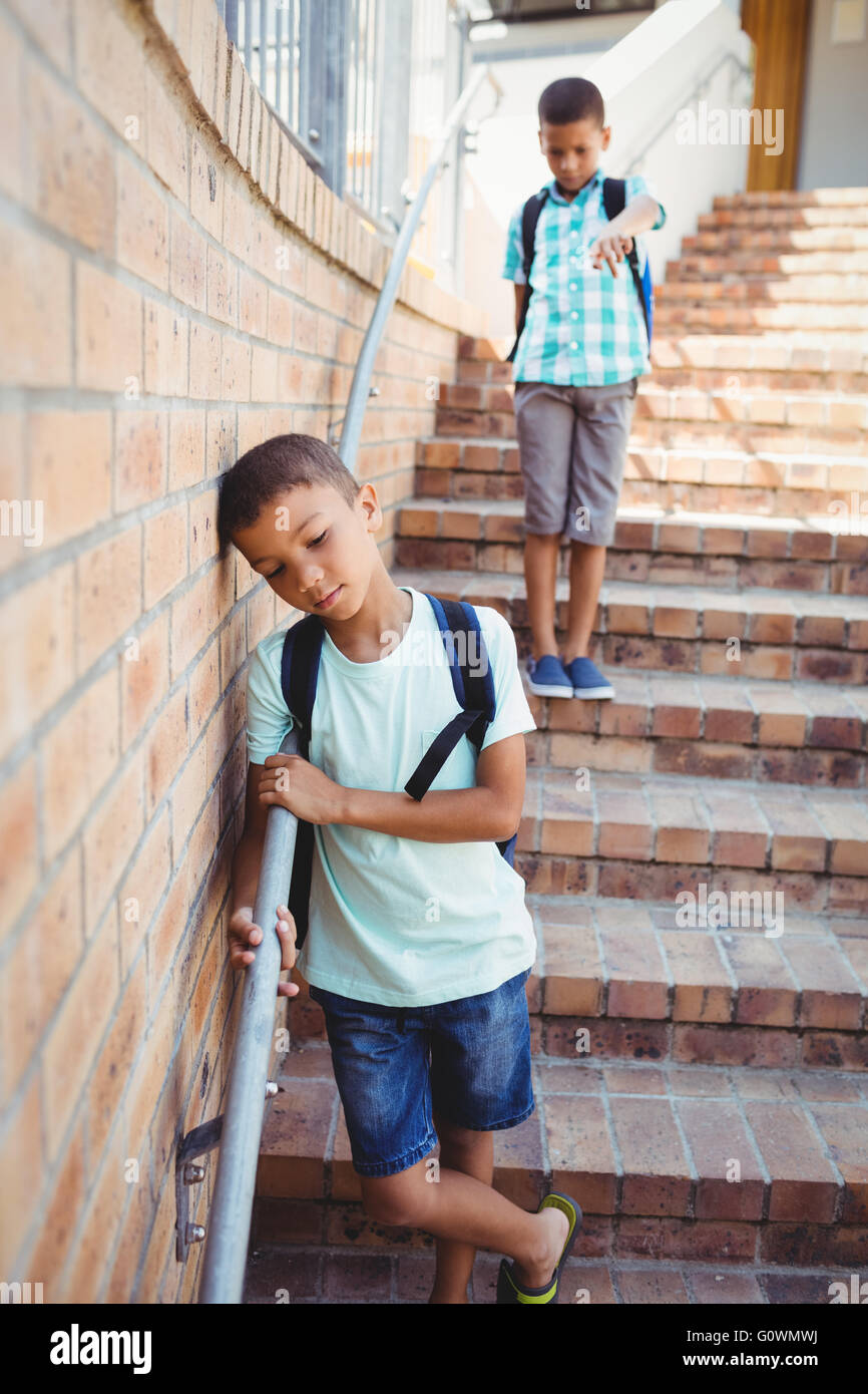 Boy pointing on another boy Stock Photo - Alamy