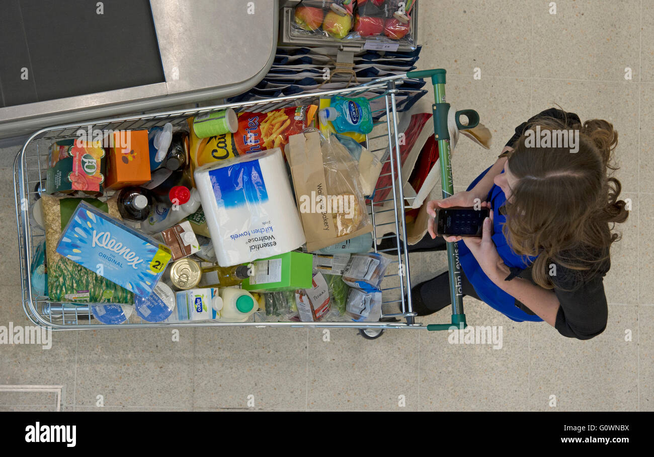 A customer at a Waitrose checkout till, England, Britain Stock Photo ...