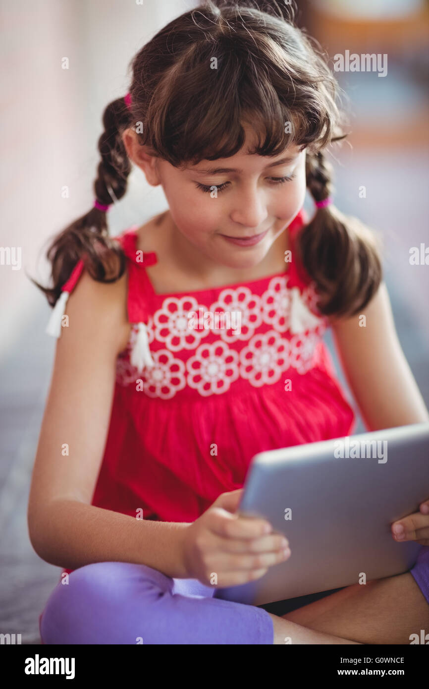 Girl looking at her digital tablet Stock Photo - Alamy