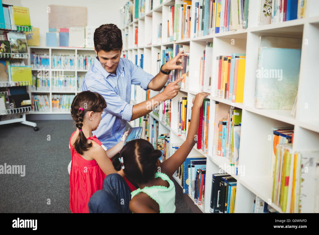 Two kids pile books hi-res stock photography and images - Alamy