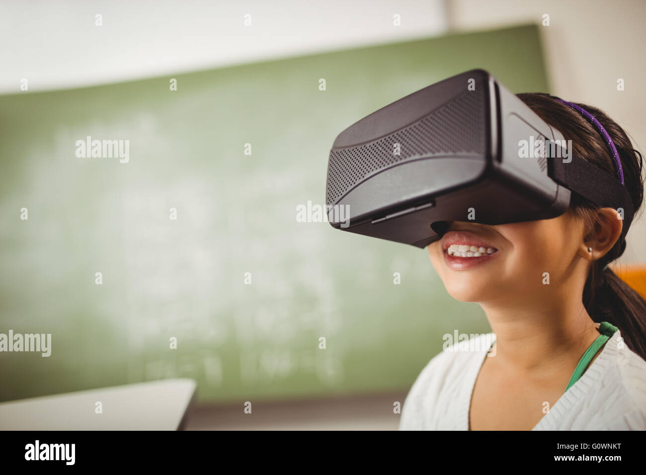 Portrait of a little girl wearing virtual reality glasses Stock Photo ...