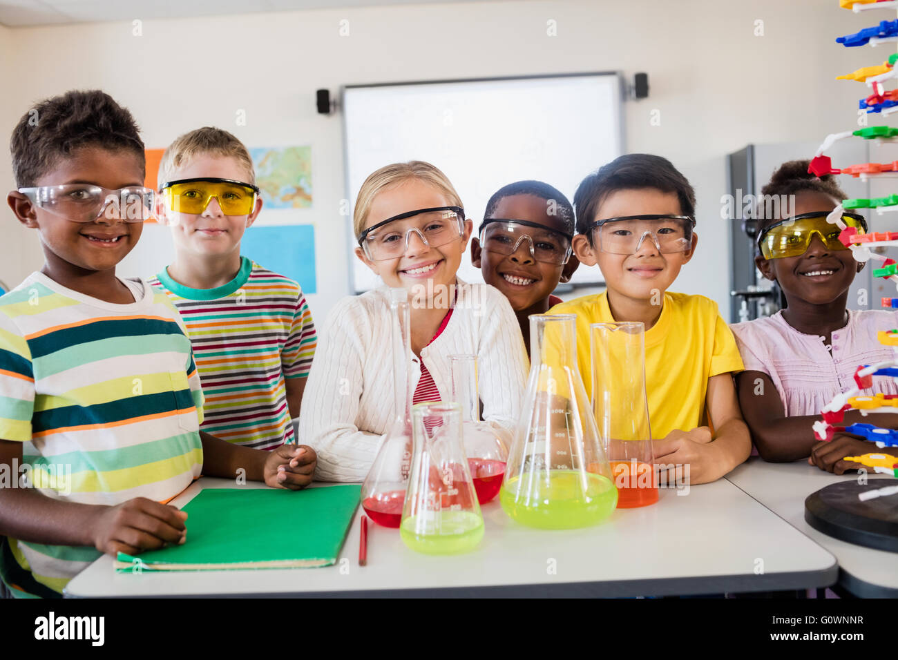Smiling pupils doing science Stock Photo - Alamy Smiling pupils doing science Stock Photo - Alamy