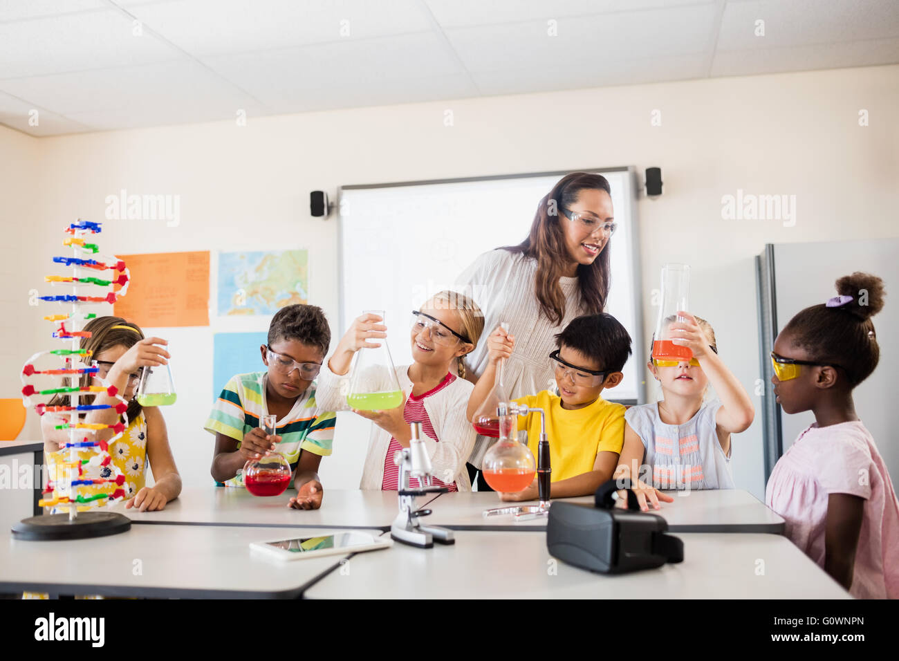 Smiling children doing science Stock Photo - Alamy Smiling children doing science Stock Photo - Alamy