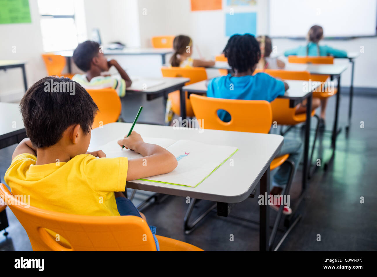 Pupils working at their desk in class Stock Photo - Alamy Pupils working at their desk in class Stock Photo - Alamy