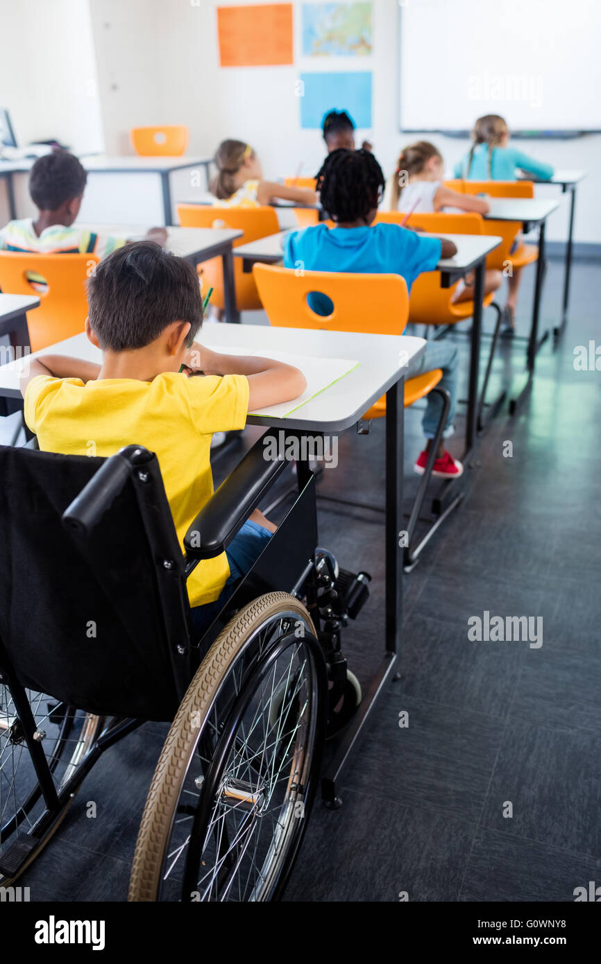Pupils studying in class Stock Photo - Alamy