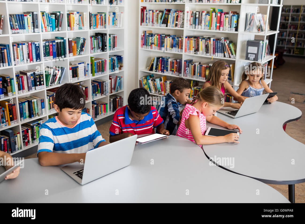 Using laptop tables hi-res stock photography and images - Alamy