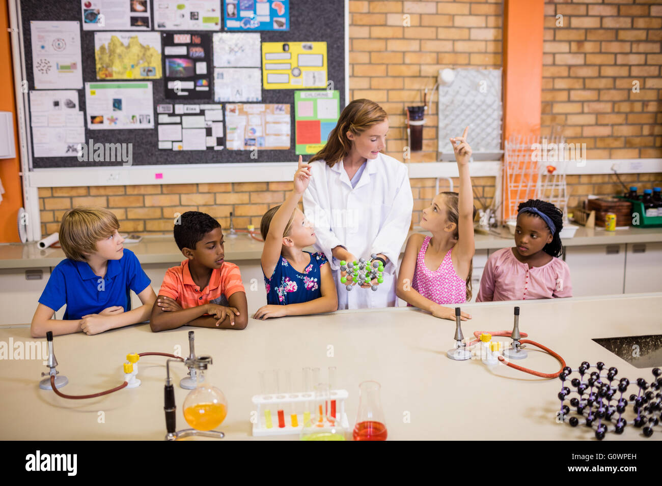 Giving book classroom hi-res stock photography and images - Alamy