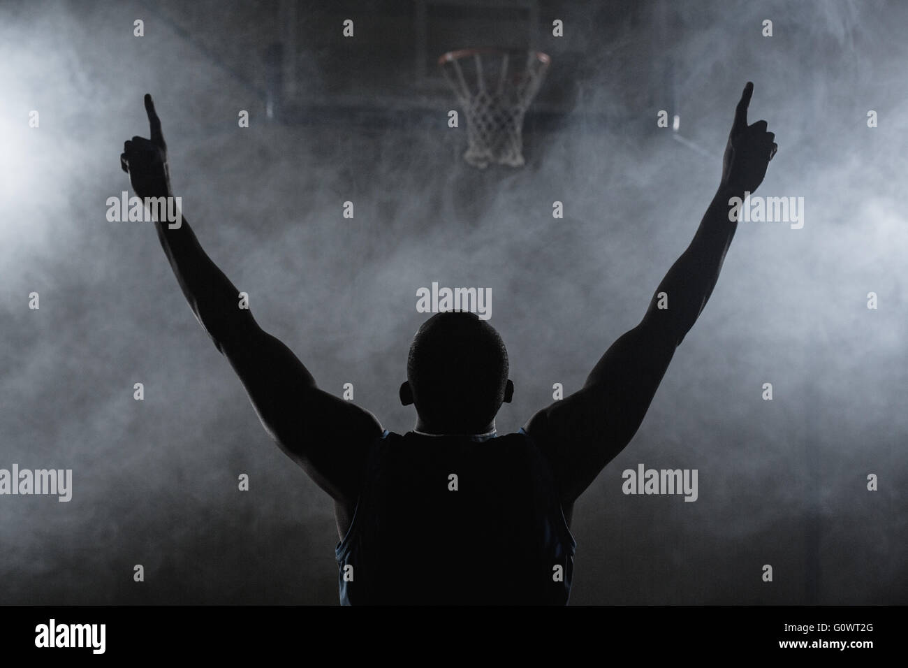Rear view of a basketball player with his arms in the air Stock Photo ...