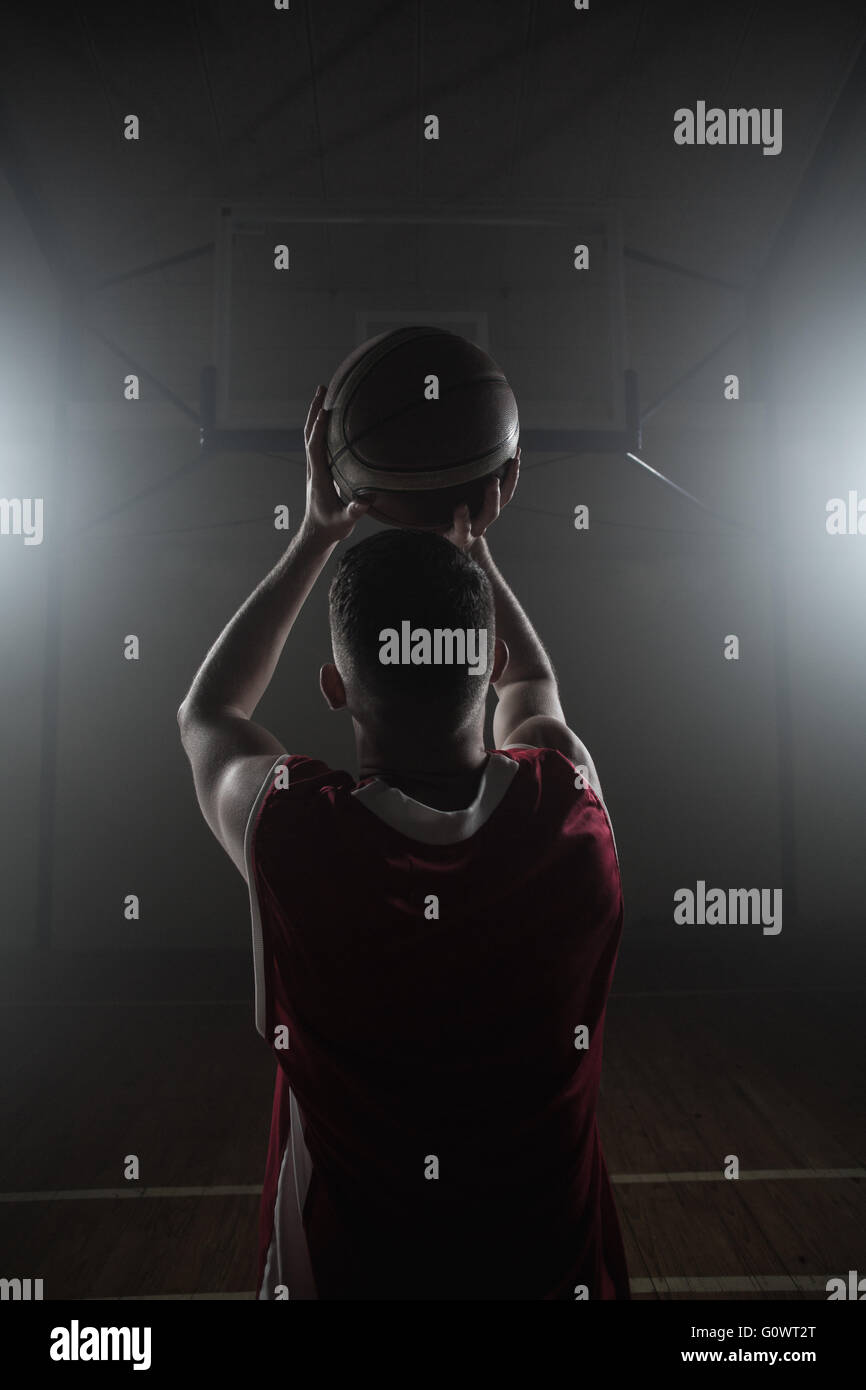 Portrait of basketball player front the back preparing to score Stock ...