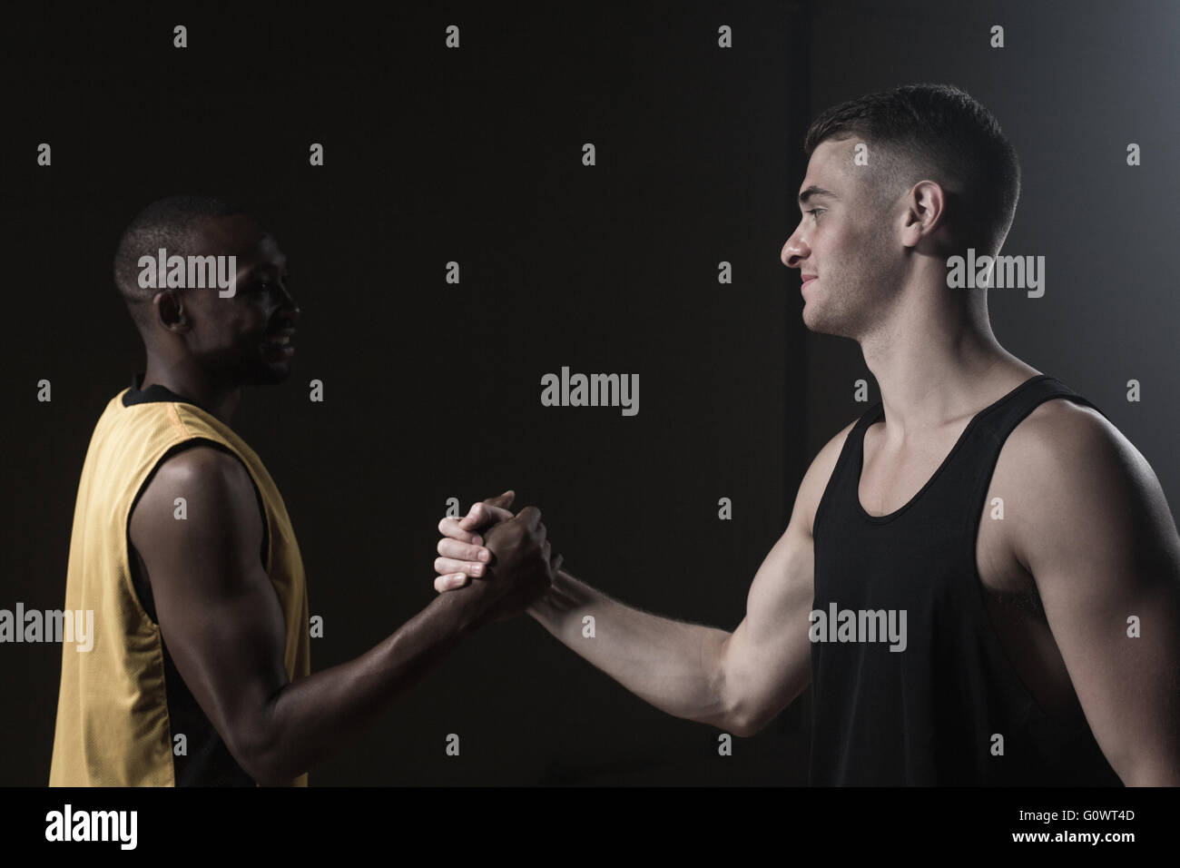 Portrait of basketball players shaking hands Stock Photo - Alamy