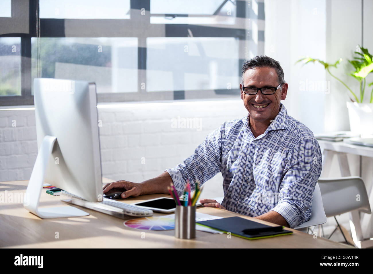 A business man working at computer desk Stock Photo - Alamy