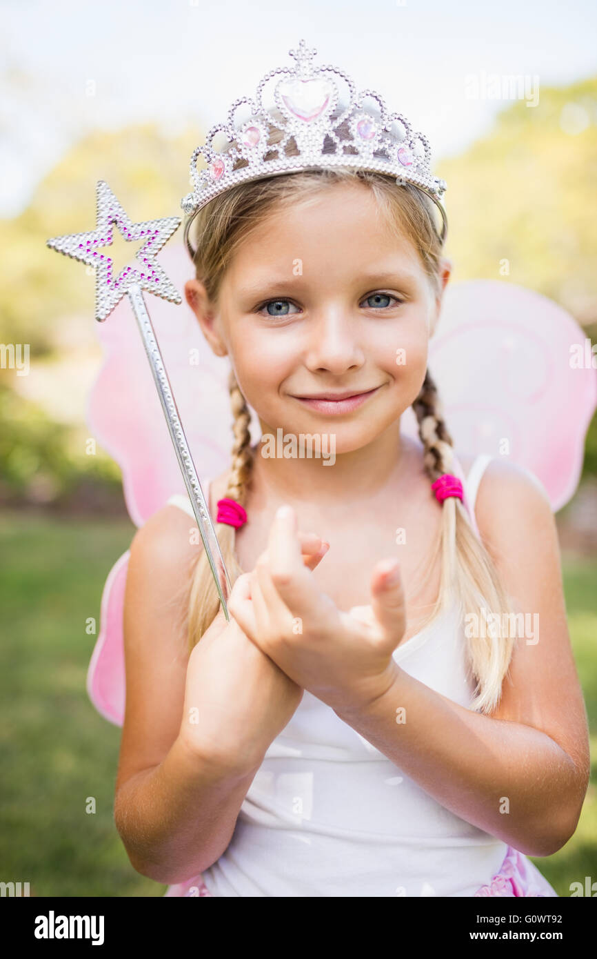 Portrait of cute girl pretending to be a princess Stock Photo - Alamy