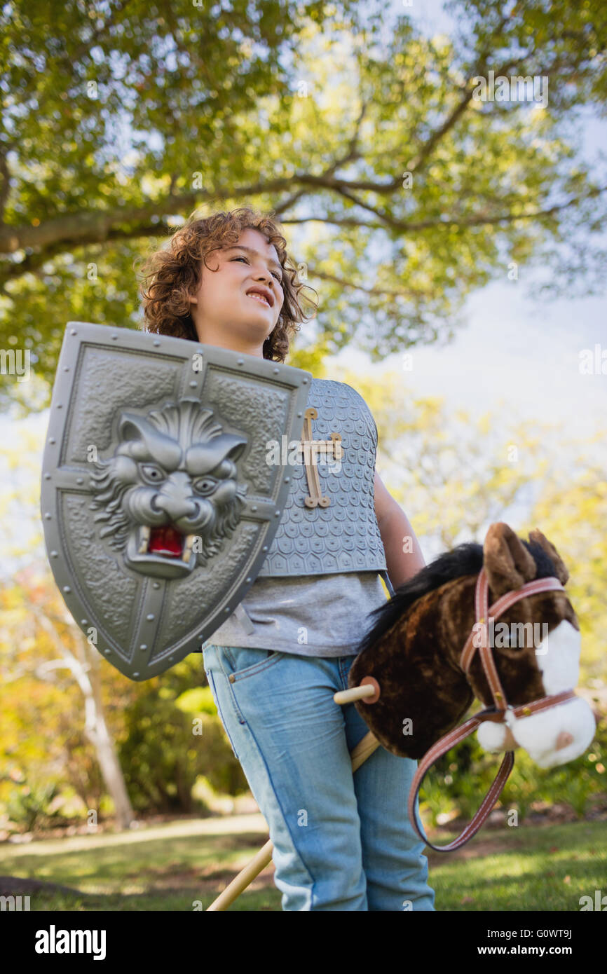 Cute boy pretending to be a knight Stock Photo - Alamy