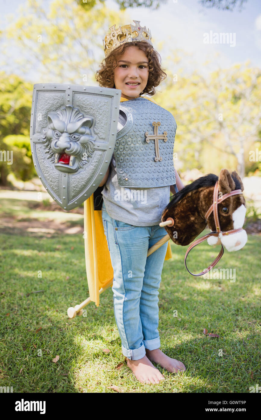 Cute boy standing and pretending to be a knight Stock Photo - Alamy