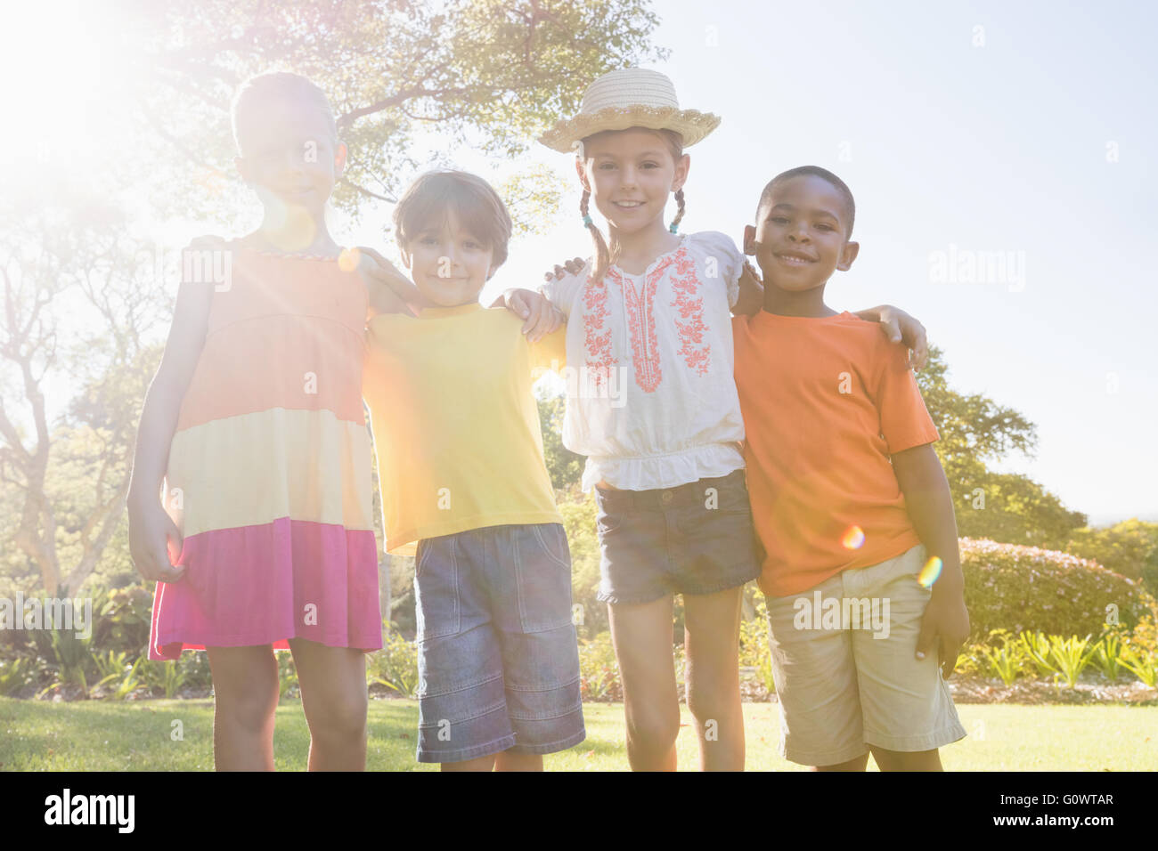 Children standing and posing for camera Stock Photo - Alamy
