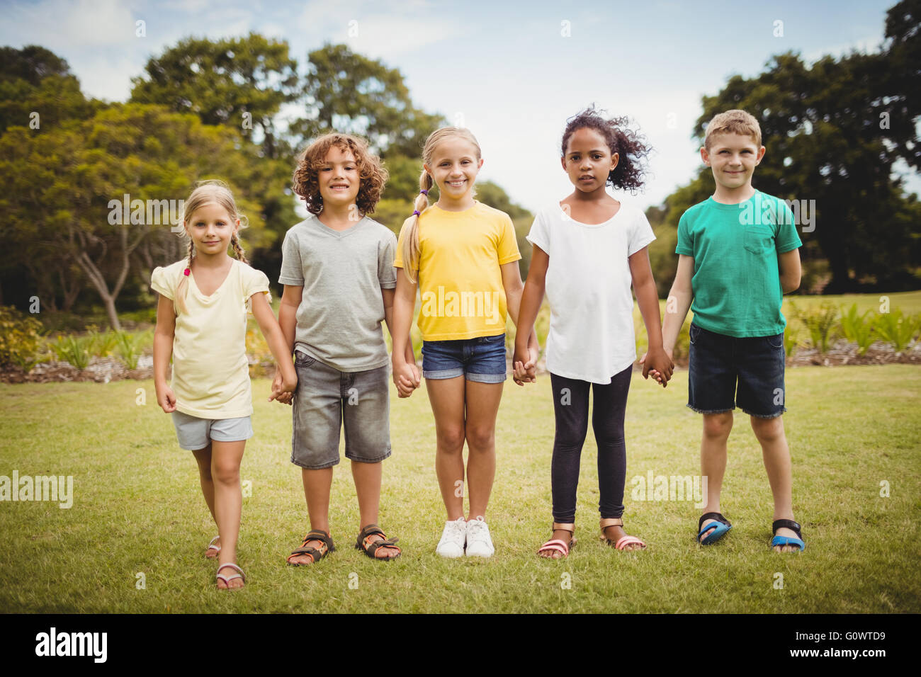 Children holding hands Stock Photo - Alamy