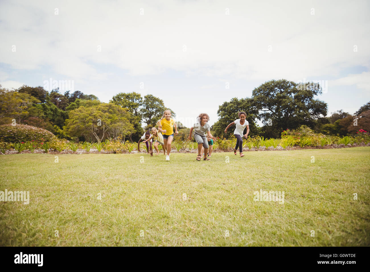 Smiling children running Stock Photo - Alamy