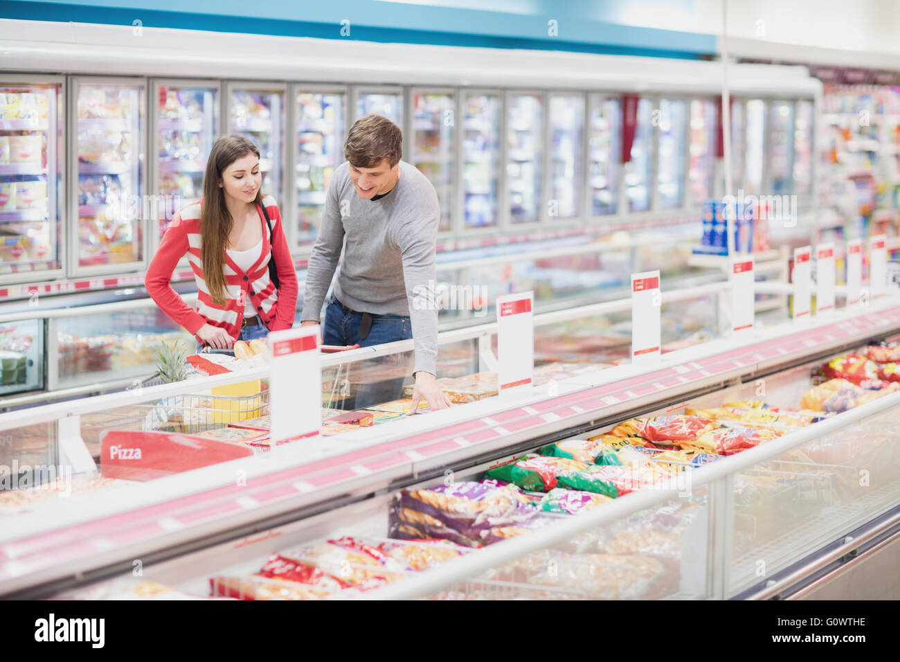 A couple choosing products together Stock Photo - Alamy