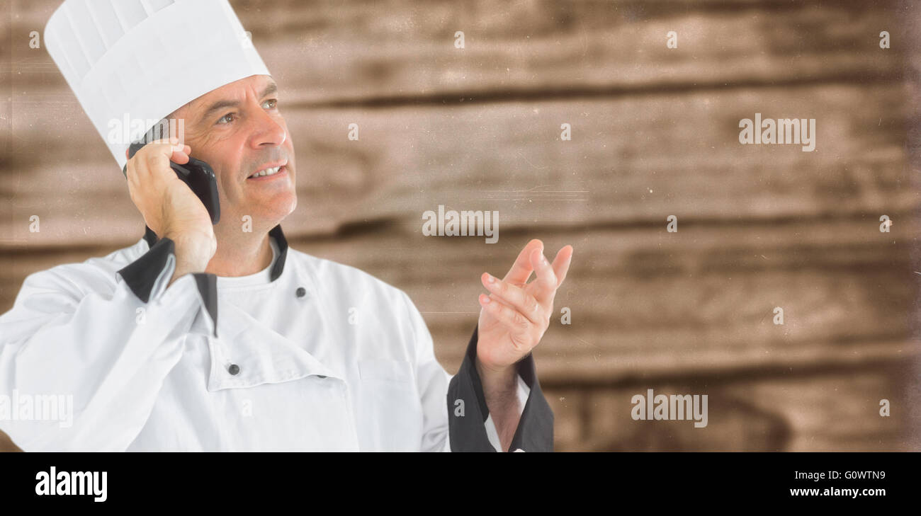 Composite image of chef calling on the phone Stock Photo - Alamy