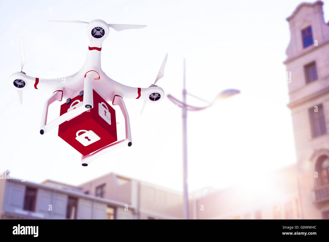 Composite image of a drone bringing a red cube Stock Photo - Alamy