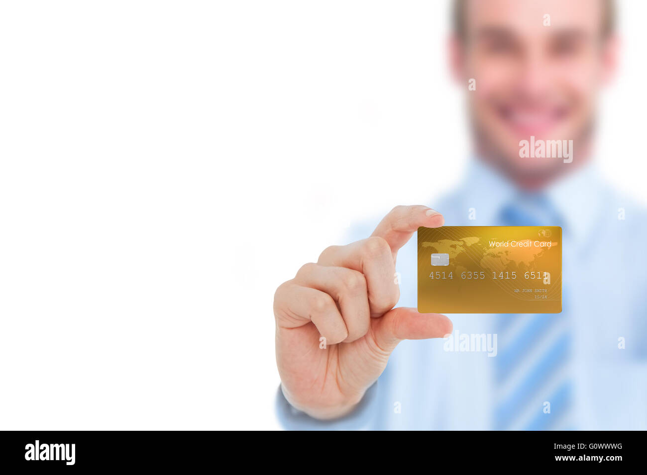 Happy businessman showing a creditcard Stock Photo - Alamy